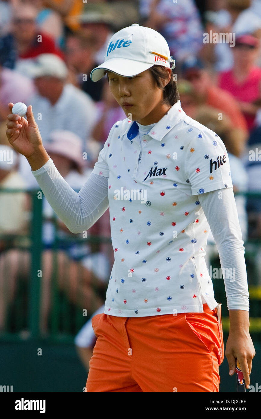 Song-Hee Kim, of South Korea, waves to the fans surrounding the 18th ...