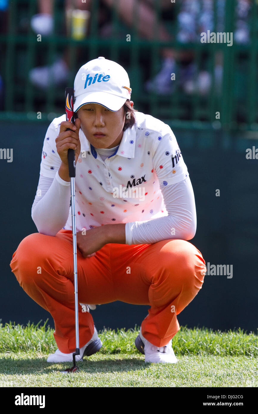 Song-Hee Kim, of South Korea, lines up her putt on the 18th green ...