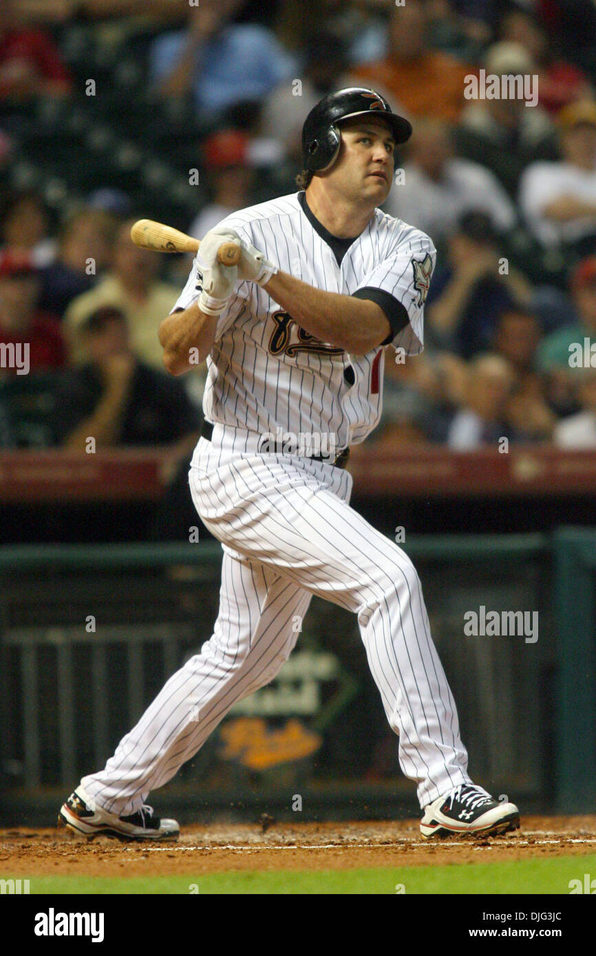 Houston Astros first baseman Lance Berkman watches the ball as it goes ...
