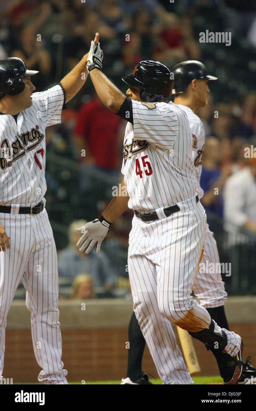 Houston Astros left fielder Carlos Lee gets a high five from Lance ...