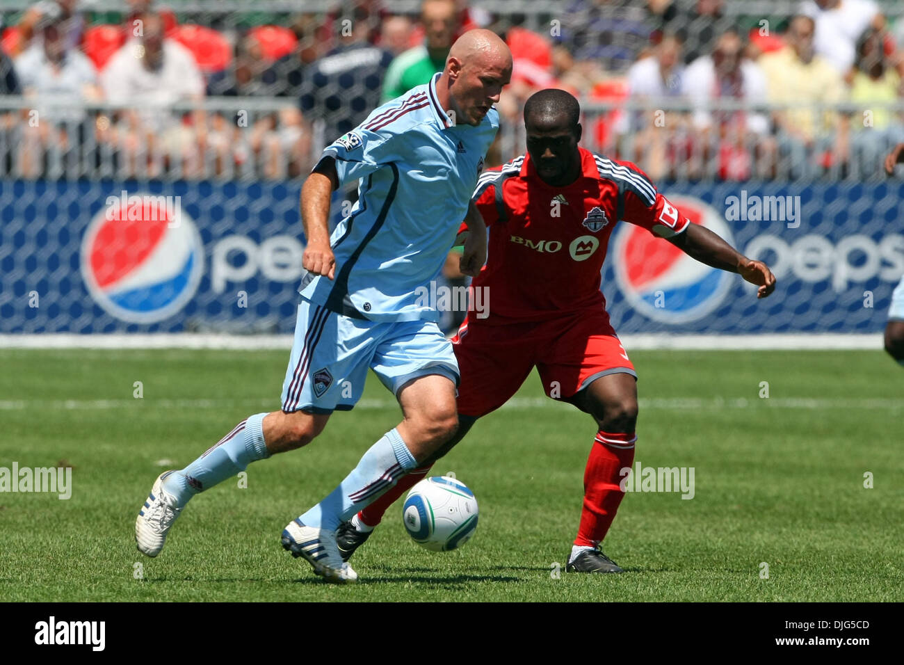 Colorado Rapids forward Conor Casey (9) and Toronto FC defender Nana ...