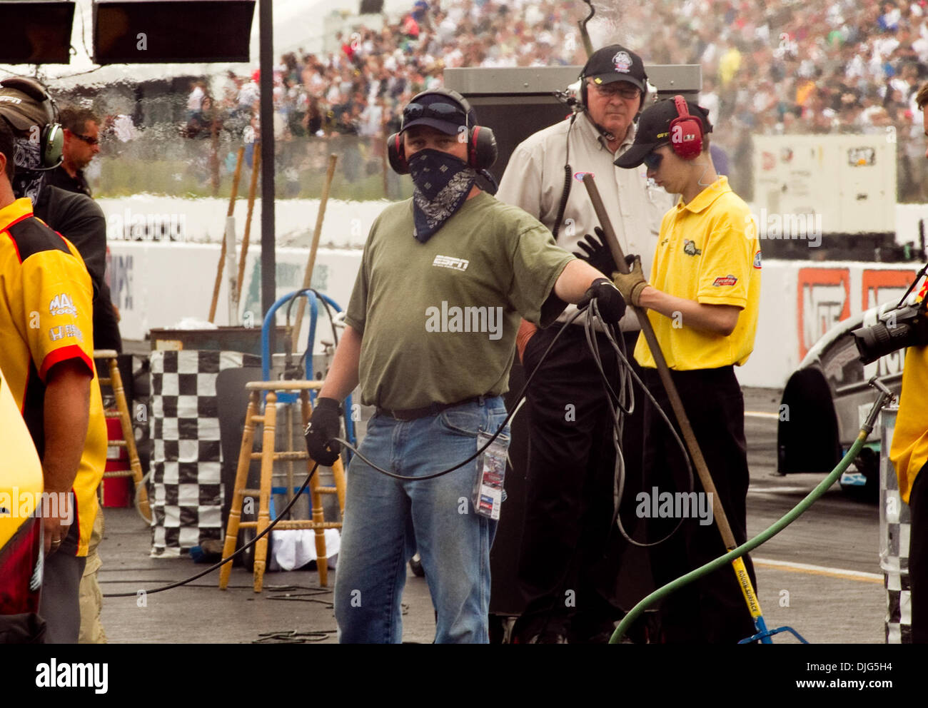 July 10th 2010, A cable runner covers his face with a bandana to help ...