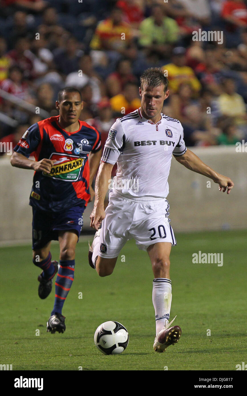 20) Brian McBride of the Chicago Fire plays the ball forward during ...