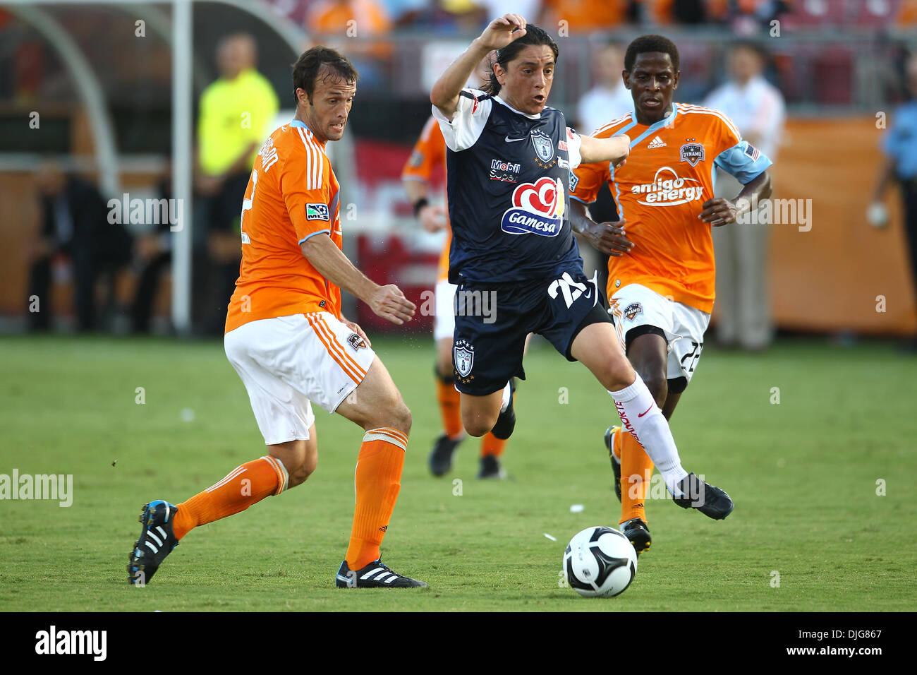 Damian Manso (#21) Midfielder for Pachuca CF splits Eddie Robinson (#2 ...