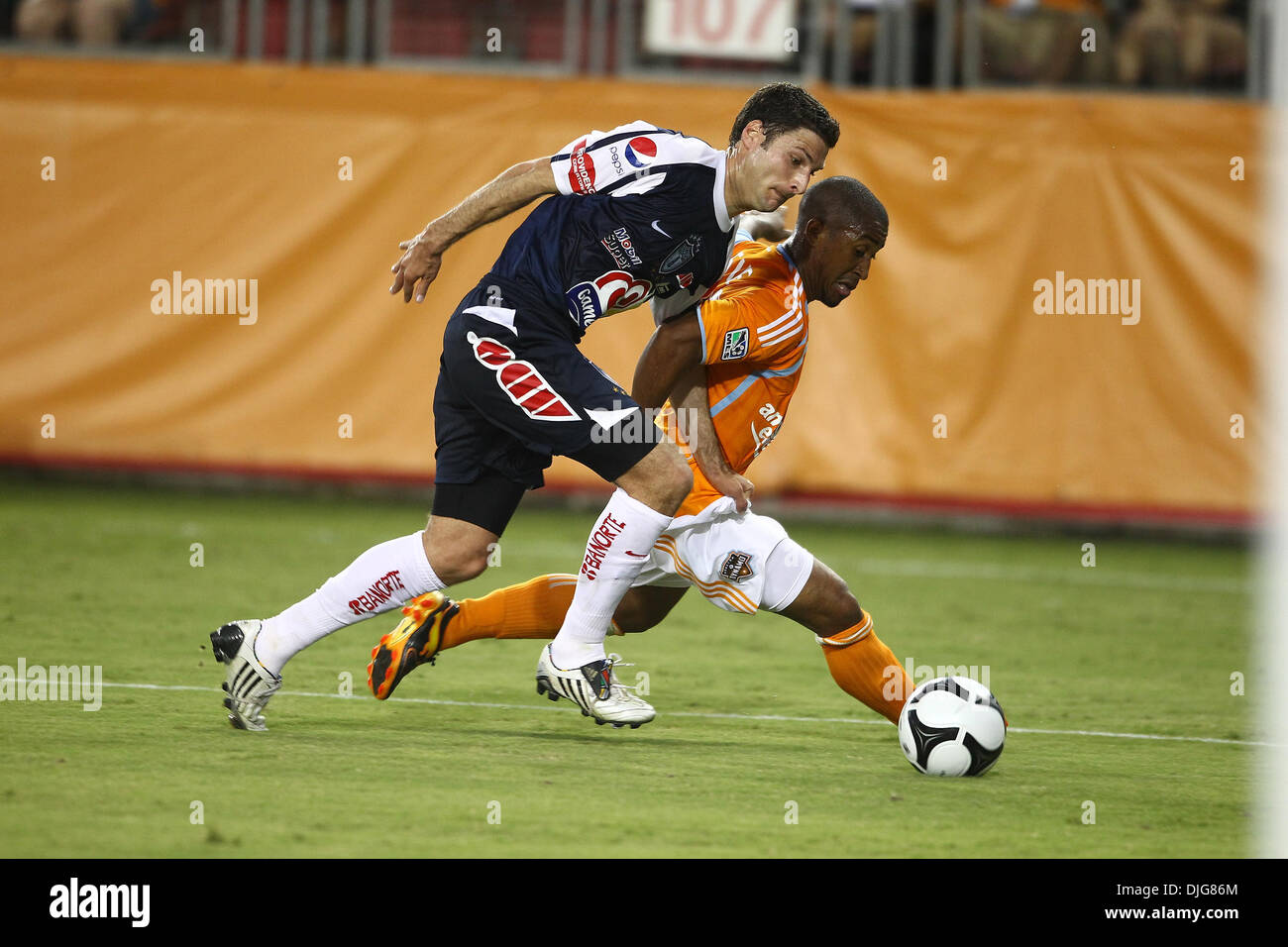 Corey Ashe (#26) Midfielder for the Houston Dynamo and Carlos Rodriguez ...
