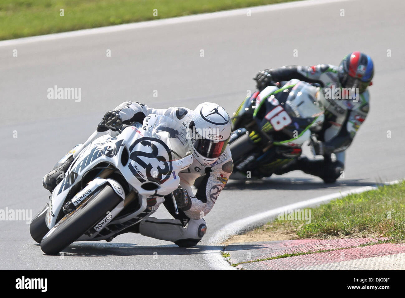 Brett McCormick on the (#23) Jordan Suzuki leads Chris Ulrich (#18 ...