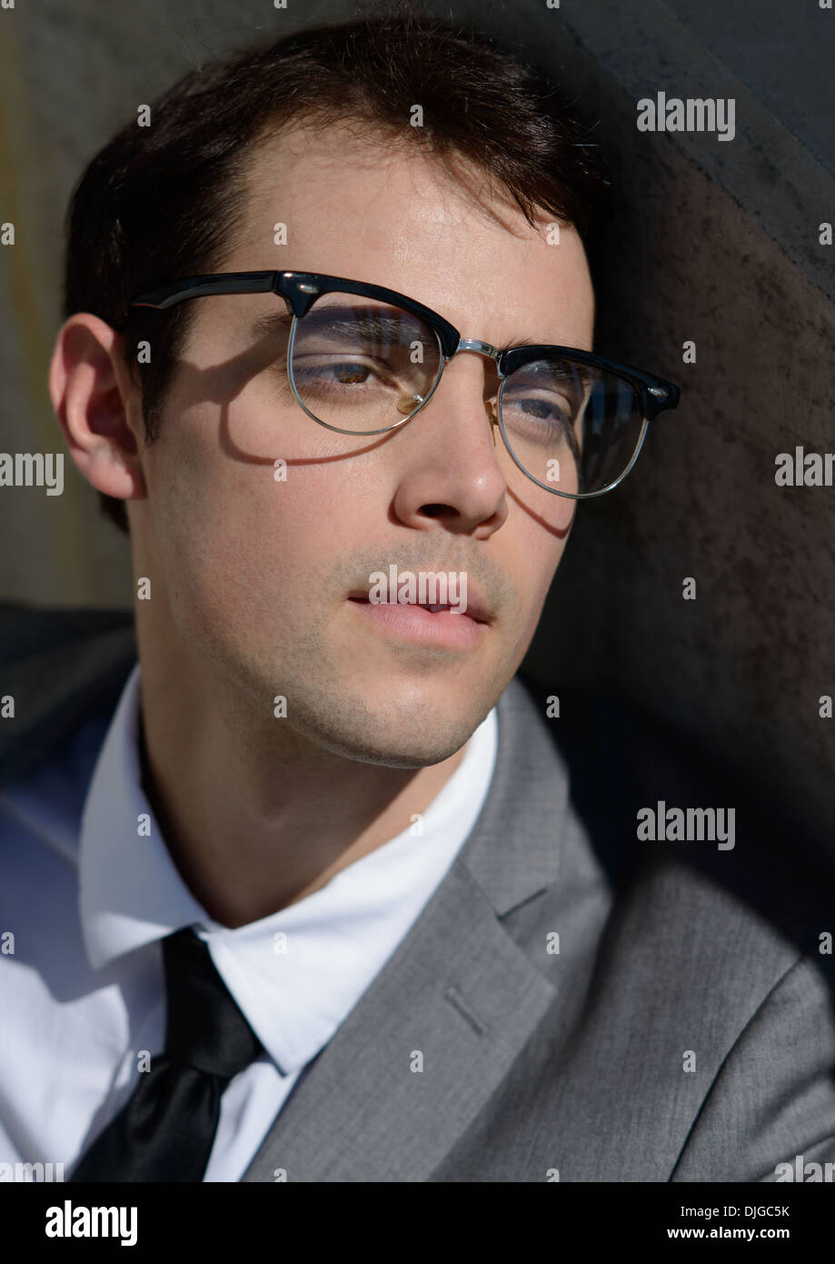 A close-up headshot of a handsome young businessman, wearing vintage ...