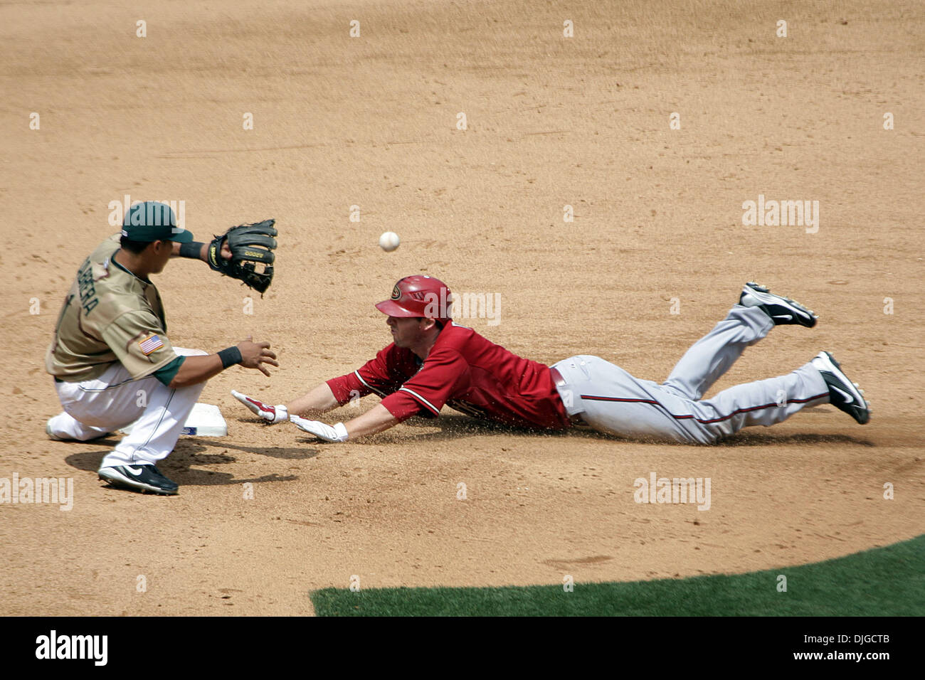 Diamondbacks Stephen Drew slides safe at second for a double against ...