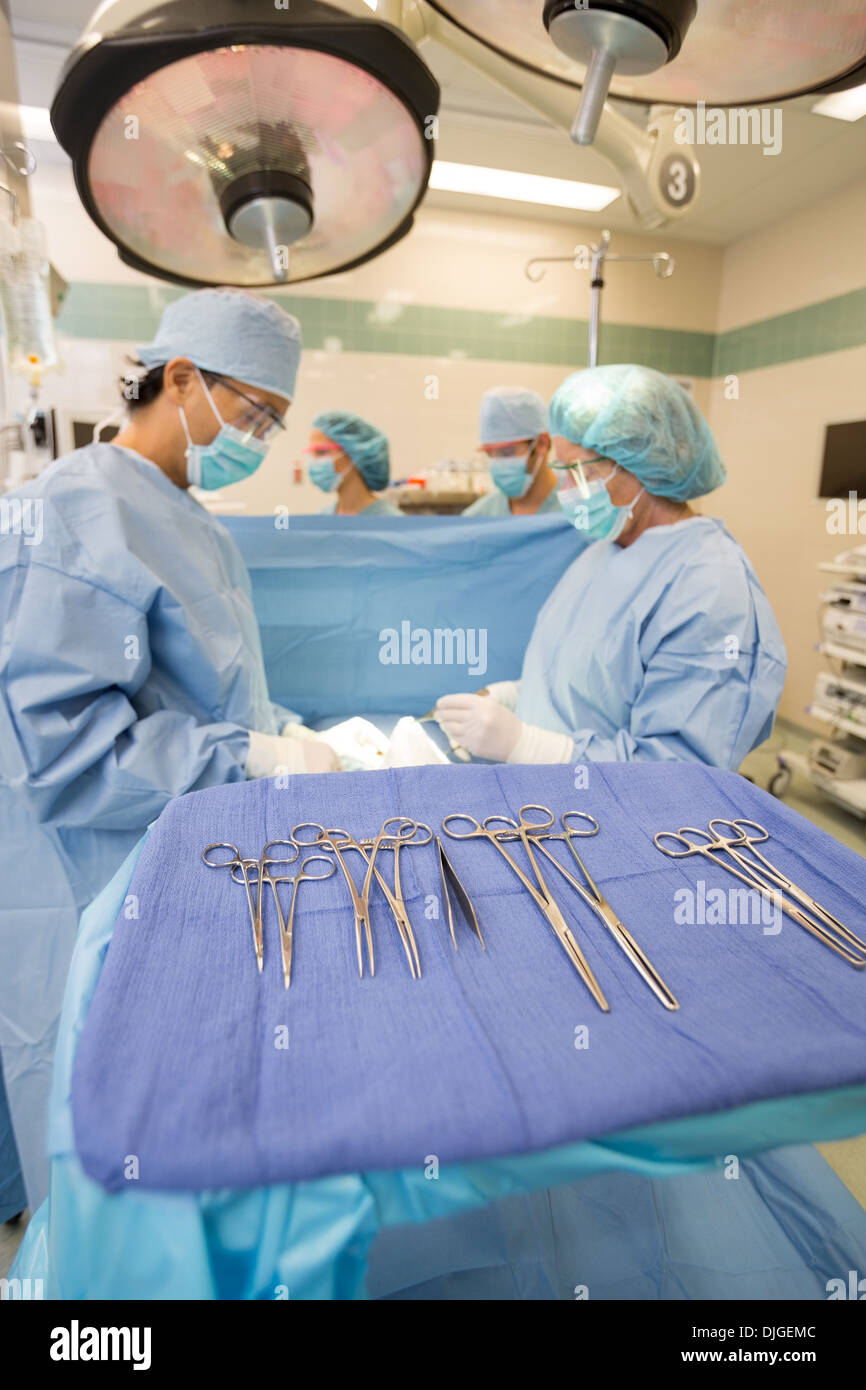 Multiethnic Doctors Operating Patient Stock Photo - Alamy