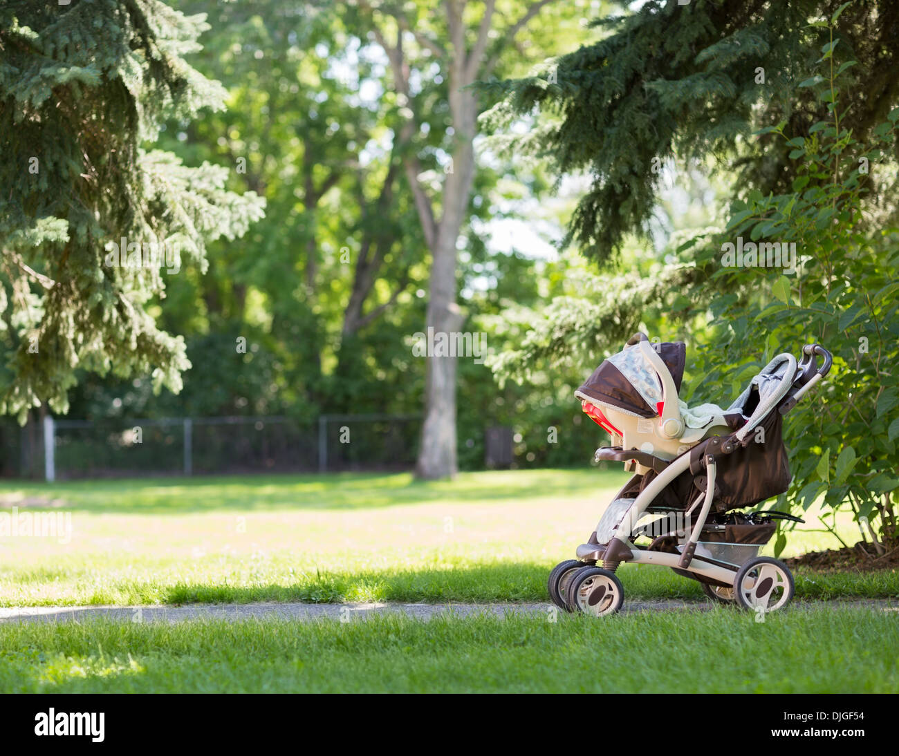 Baby Stroller In Park Stock Photo - Alamy