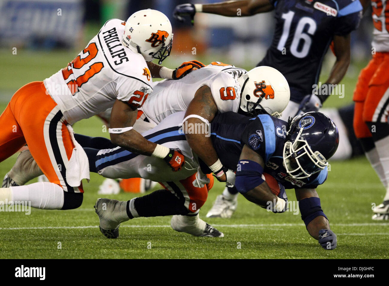 Toronto Argonauts running back Cory Boyd (3) is tackled by BC Lions ...