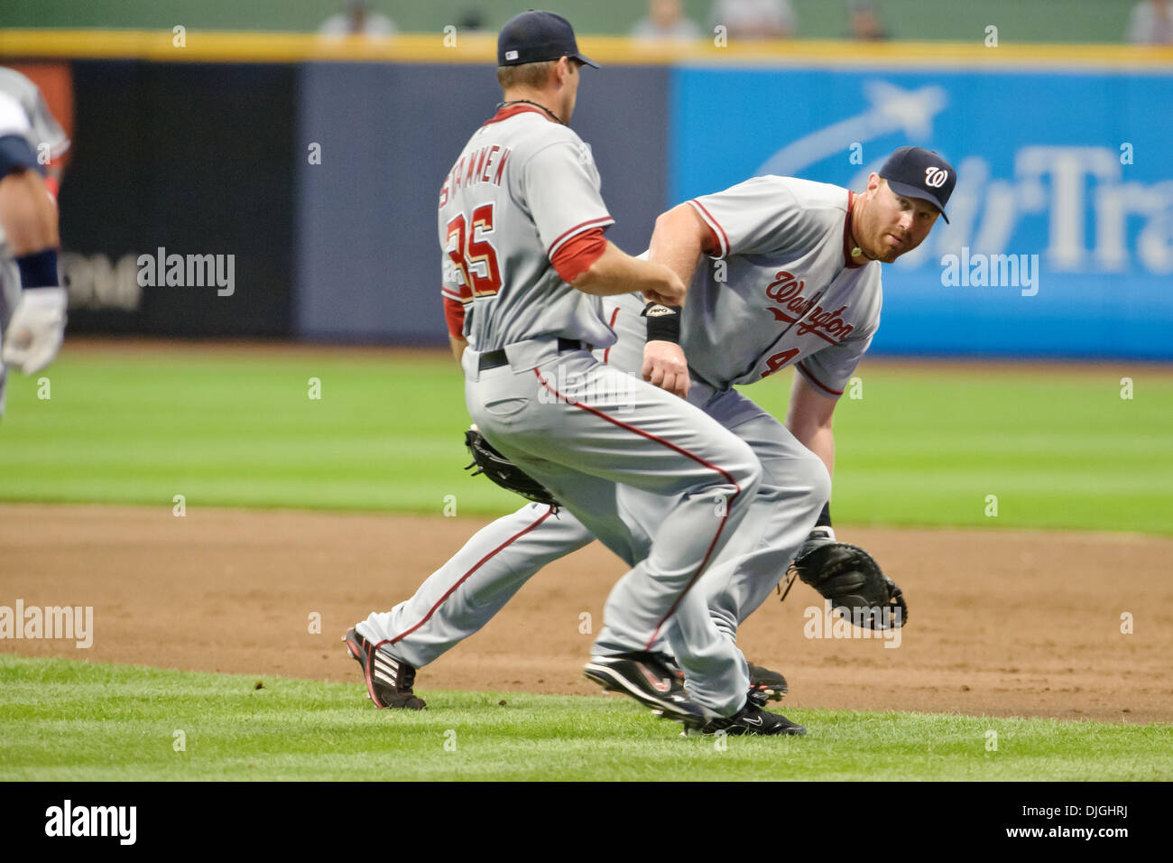 Washington Nationals first baseman Adam Dunn (44) field a ground ball ...