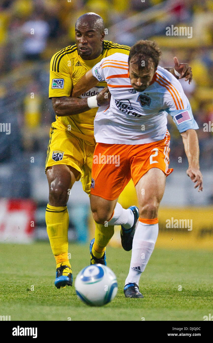 Crew forward Emilio Renteria (20) and Dynamo defender Eddie Robinson (2 ...