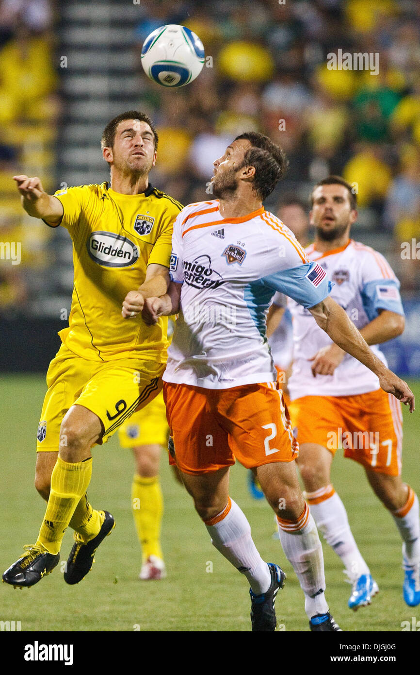 Crew forward Jason Garey (9) and Dynamo defender Eddie Robinson (2 ...