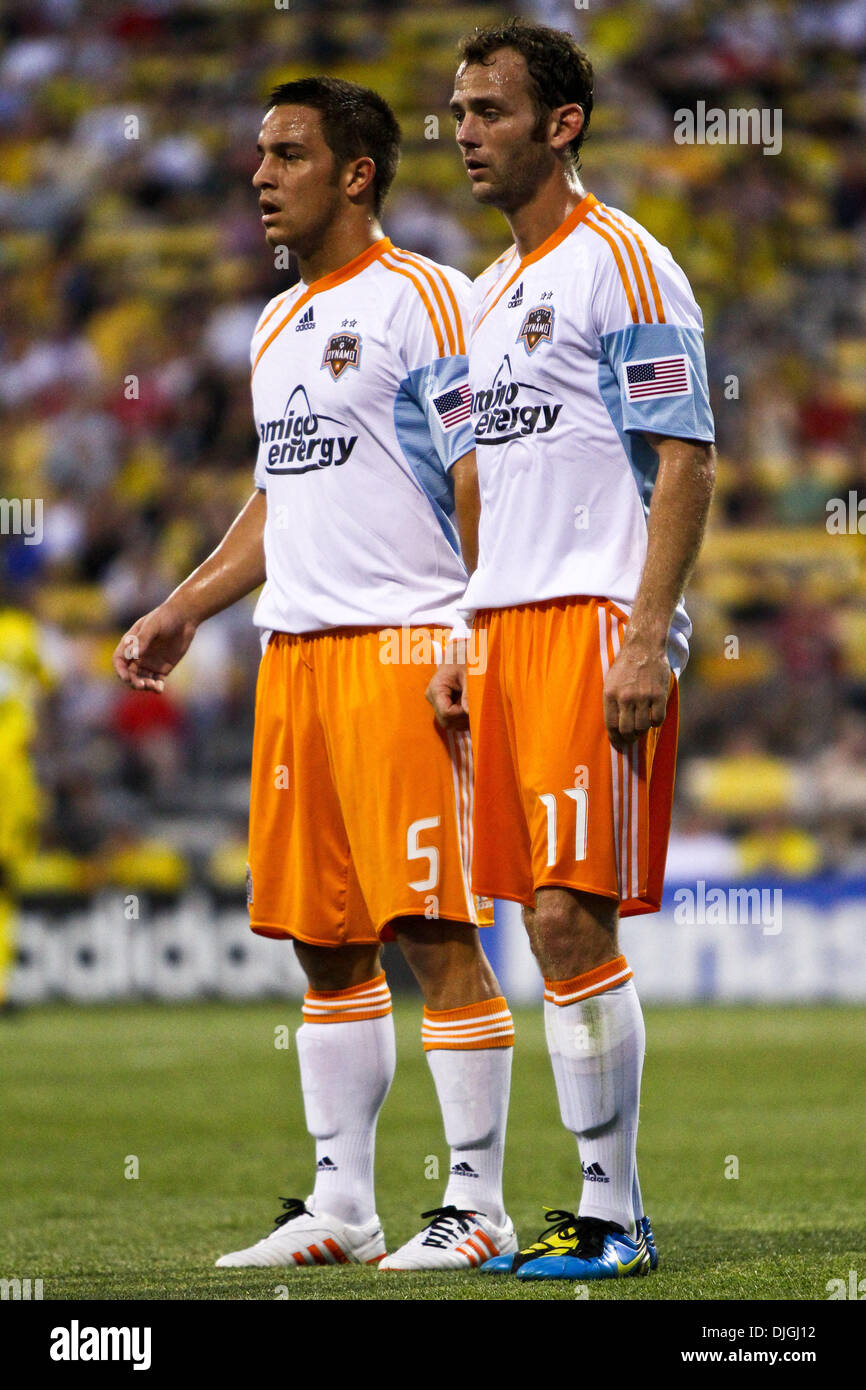 Dynamo midfielders Danny Cruz (5) and Brad Davis (11) during second ...