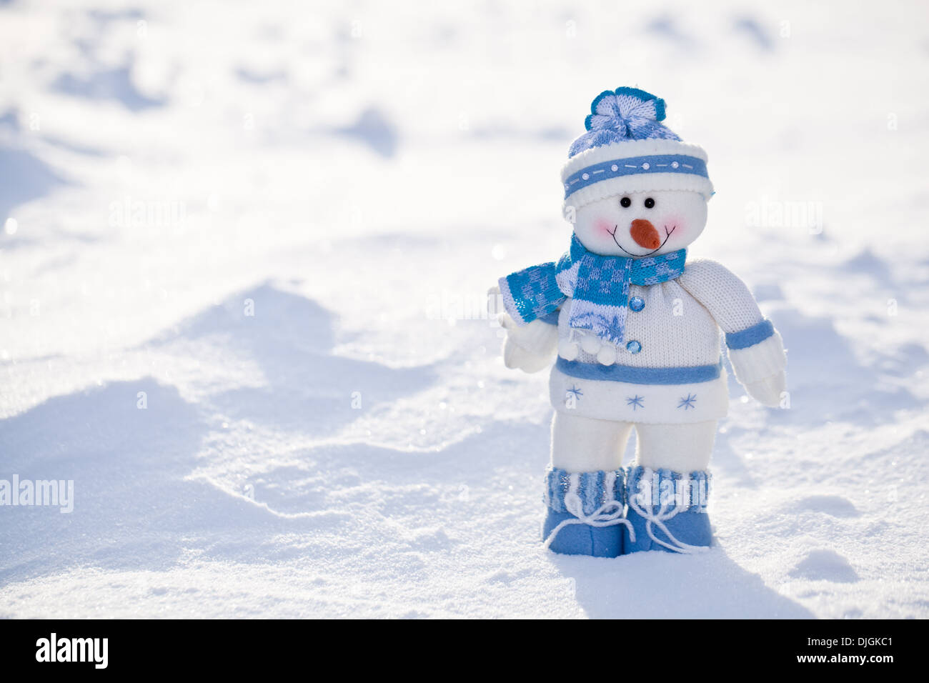 Little snowman with carrot nose in the snow Stock Photo - Alamy