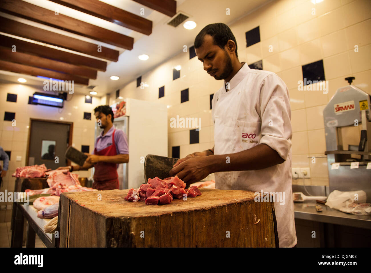Man chopping meat at meat market hi-res stock photography and images ...