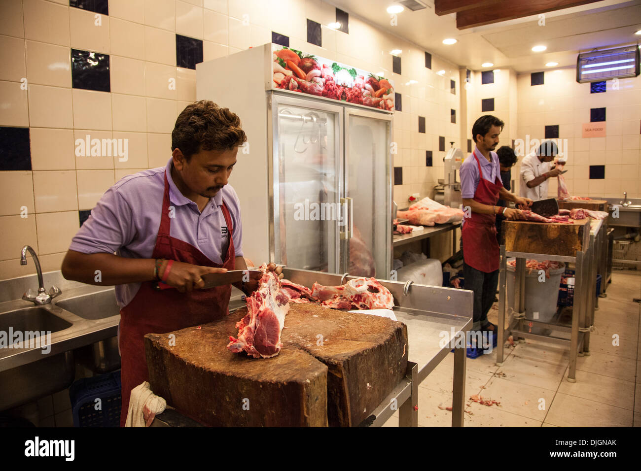 Man chopping meat at meat market hi-res stock photography and images ...