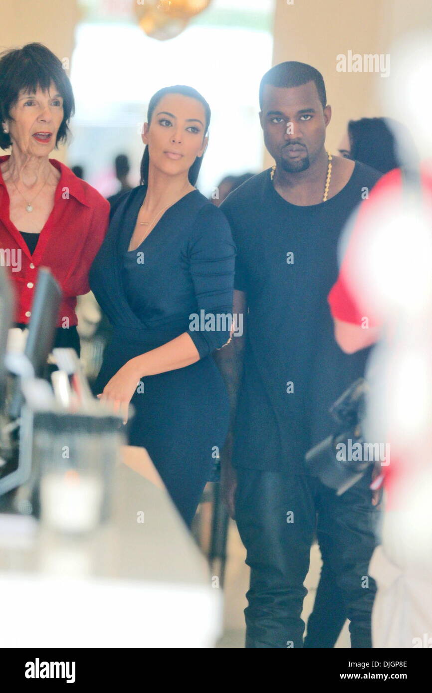 Kim Kardashian and boyfriend Kanye West attend the grand opening for ...