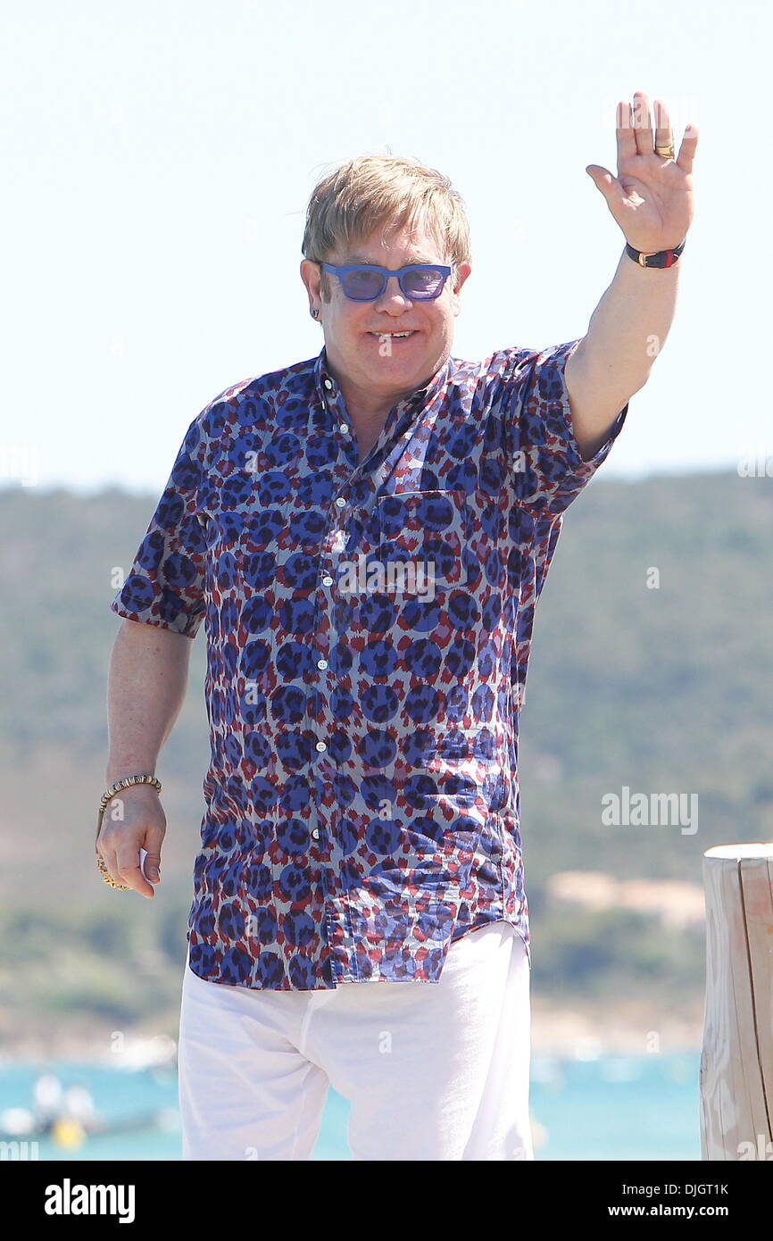 Elton John heads to Club 55 for lunch during a holiday with friends in ...