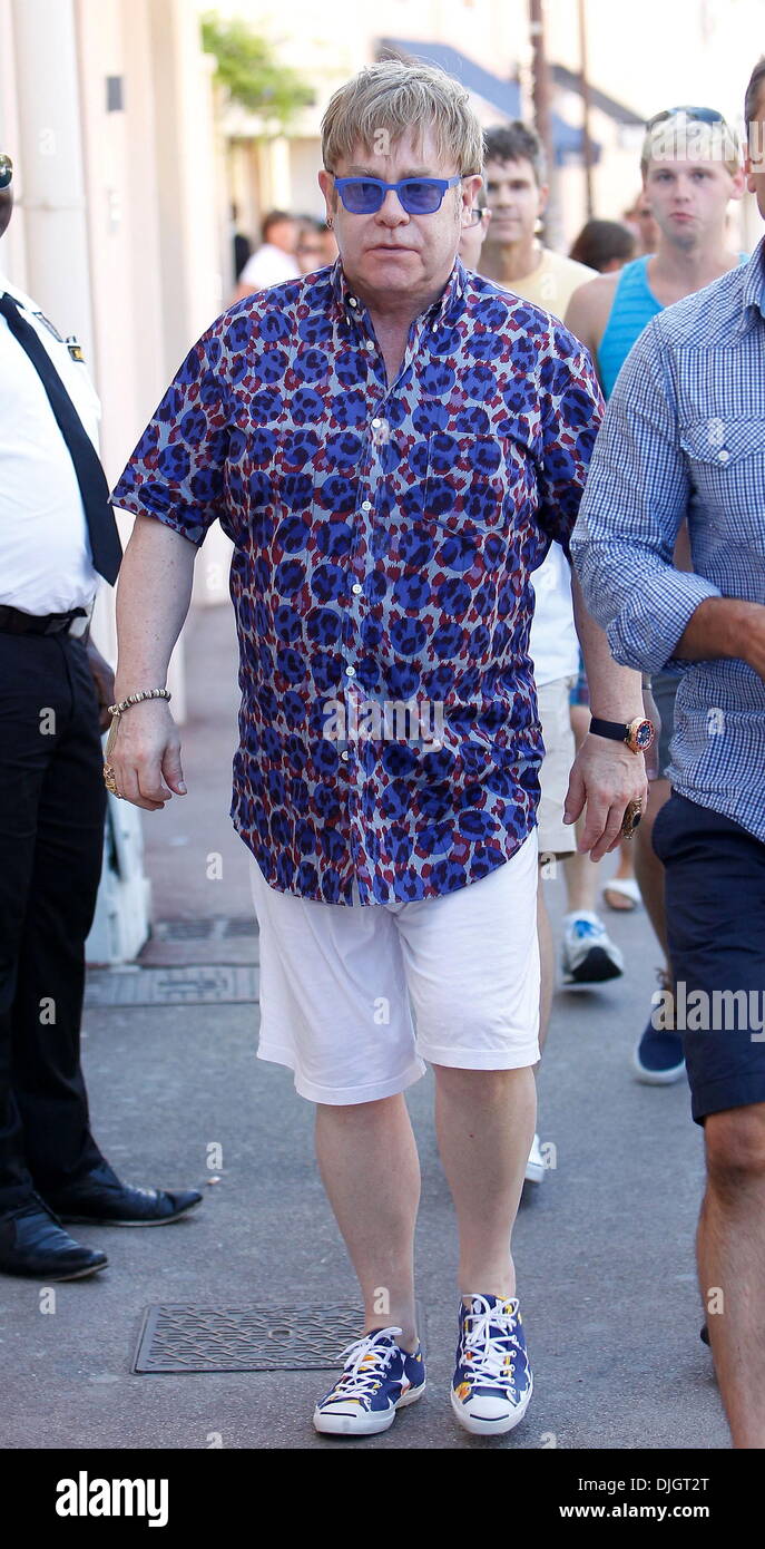 Elton John heads to Club 55 for lunch during a holiday with friends in ...
