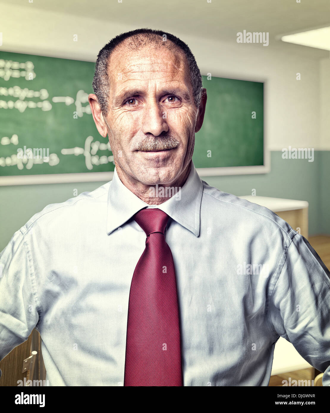 portrait of senior teacher and class background Stock Photo - Alamy