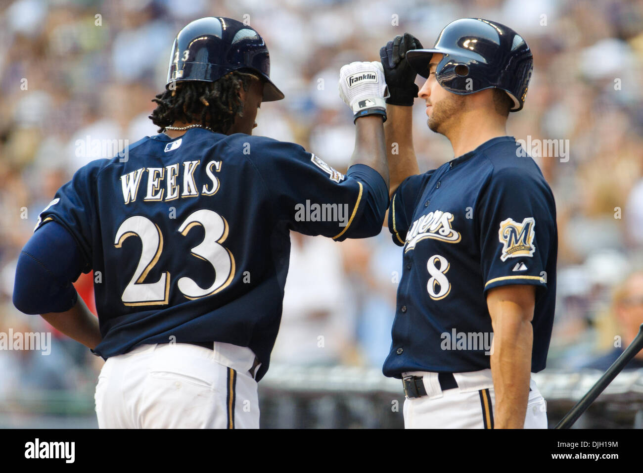 Milwaukee Brewers second baseman Rickie Weeks (23) is congratulated by ...