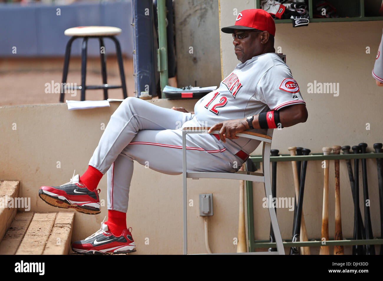 Reds manager Dusty Baker relaxing in the dugout during the MLB game ...
