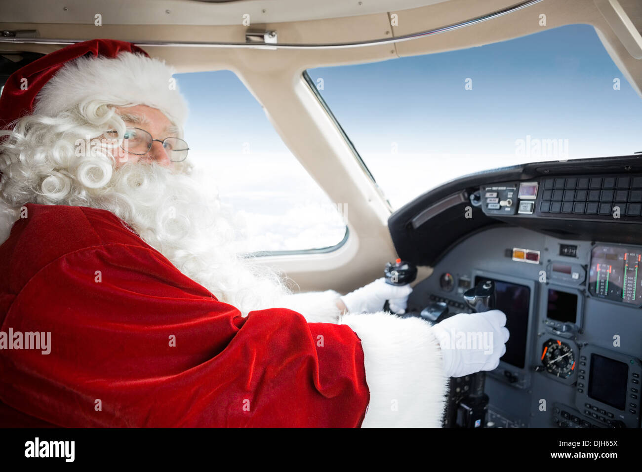Santa Holding Control Wheel In Cockpit Of Private Jet Stock Photo - Alamy