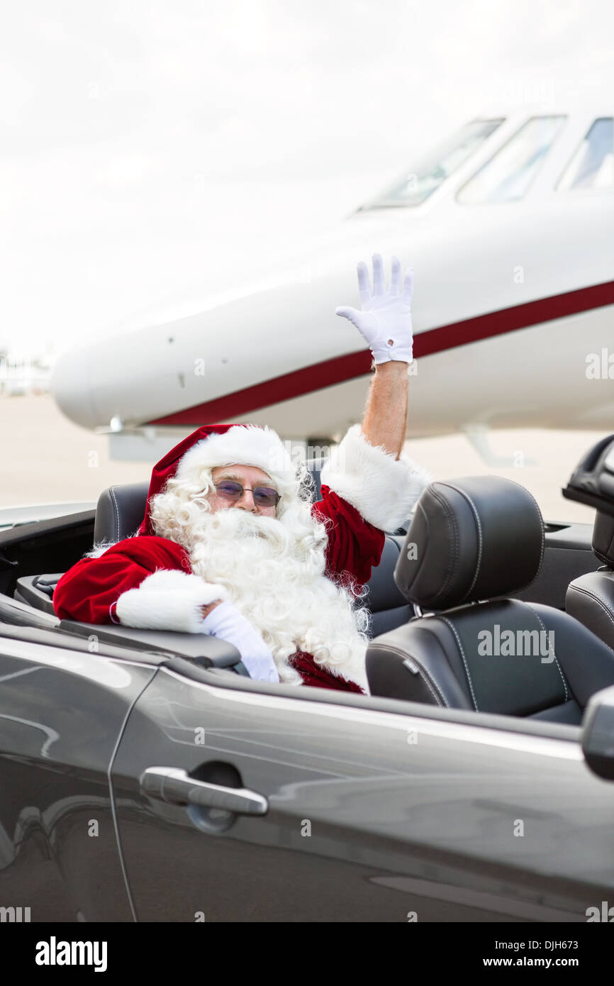 Santa in sleigh waving hi-res stock photography and images - Alamy
