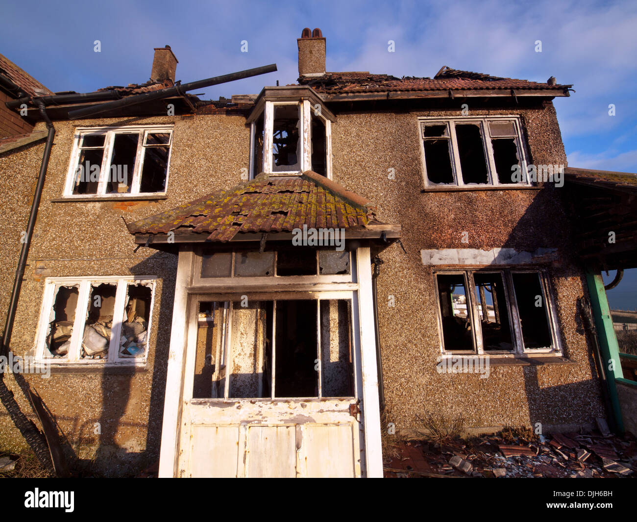 A house on the South Coast seafront that has been seriously damaged by ...