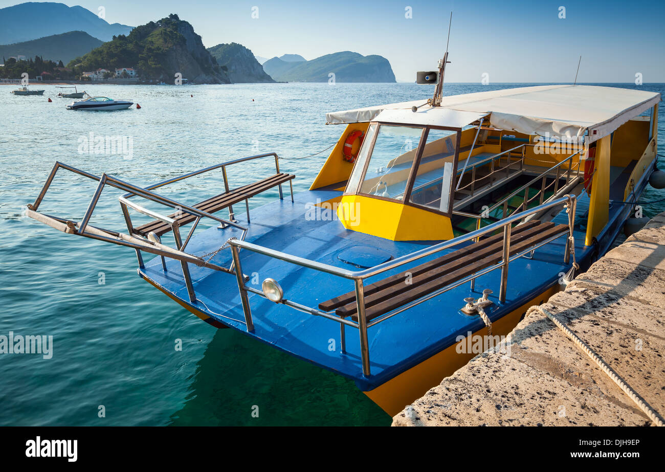 Pleasure boat with glass bottom floats moored in Adriatic sea water ...