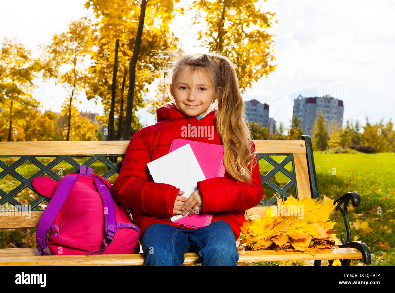 Nice girl sitting on bench hi-res stock photography and images - Alamy