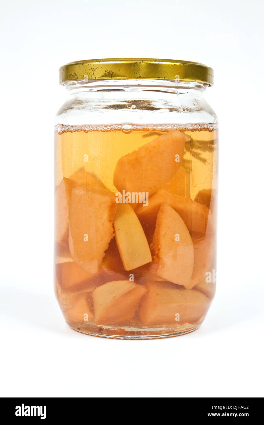 Compote made of chopped fresh fruit with sugar syrup enclosed in glass ...