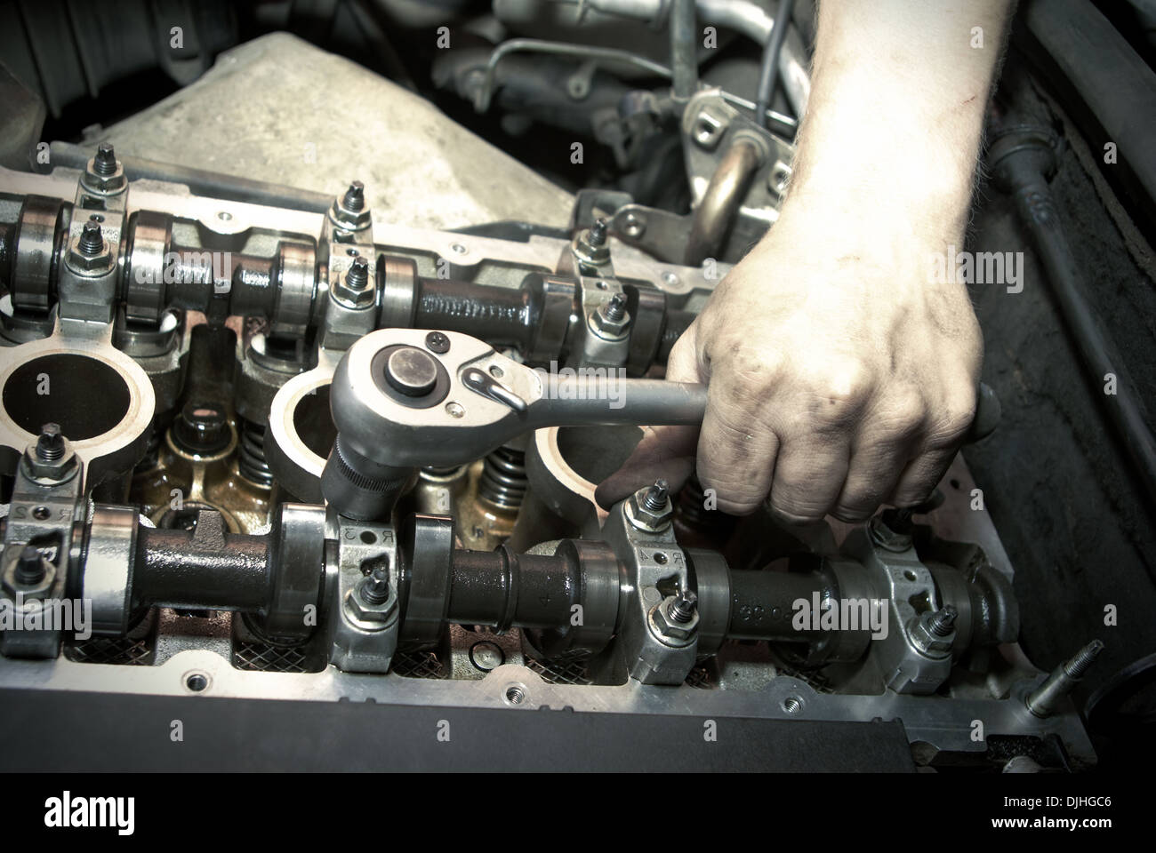 Repair of the engine. A hand with the tool. Automobile service Stock ...
