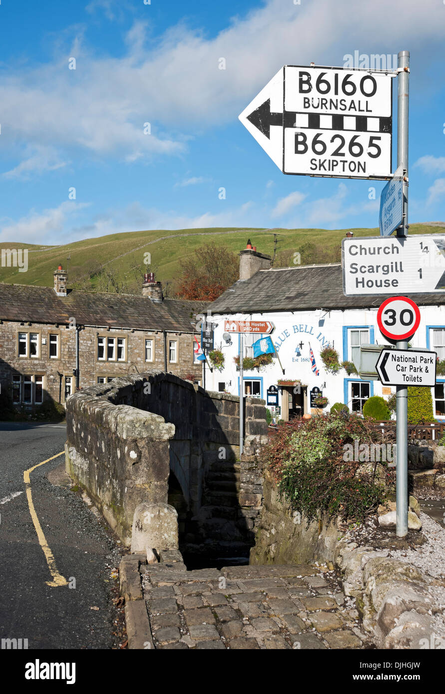 Old traditional fashioned road sign signs Kettlewell village Yorkshire ...