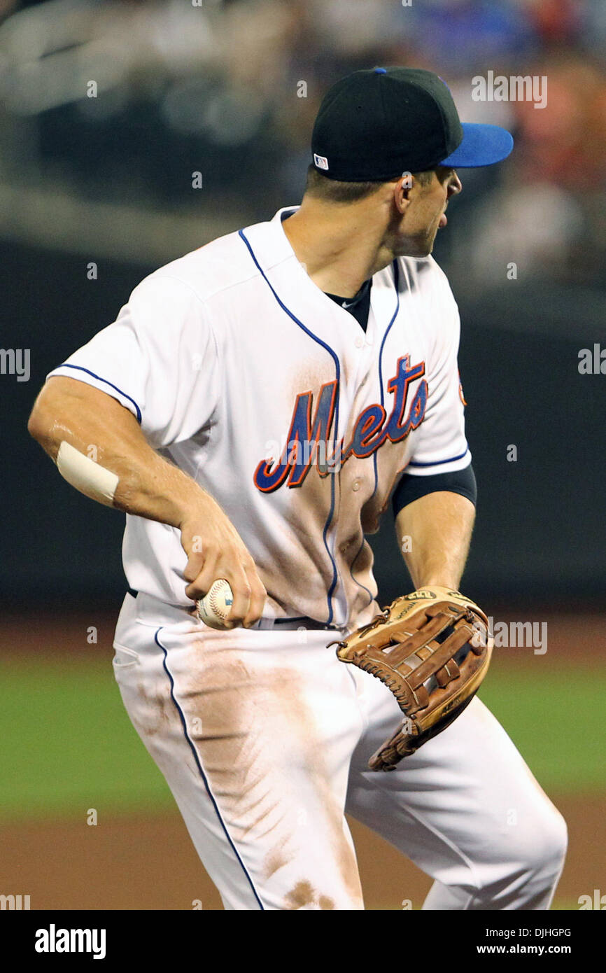 New York Mets infielder David Wright (#5) sends a ball to first during ...
