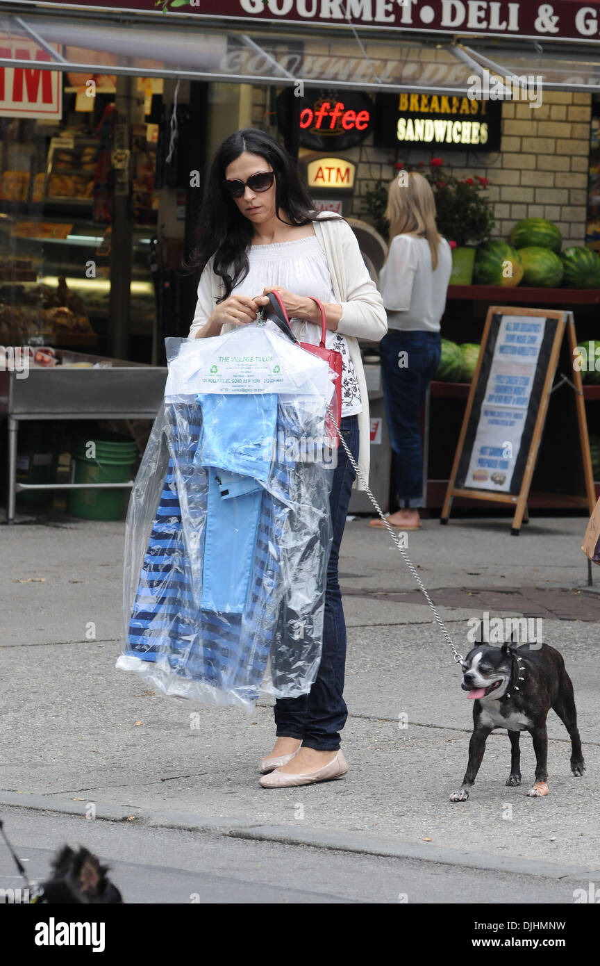 Actress Famke Janssen seen in SoHo walking her dog while holding her ...