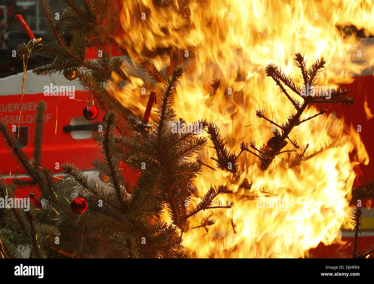 Duesseldorf, Germany. 28th Nov, 2013. A Christmas tree is set on fire ...