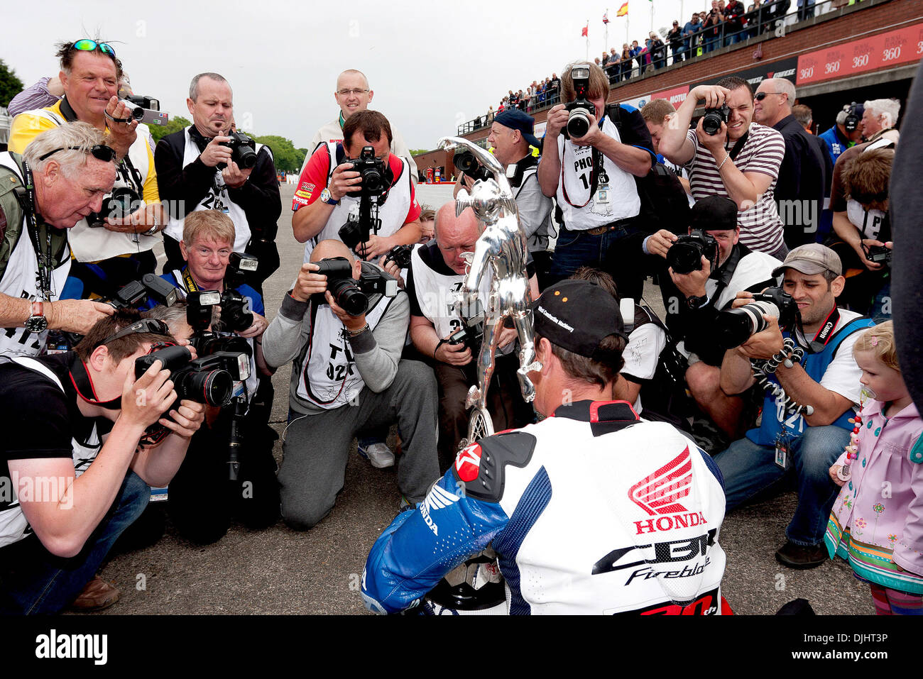 John McGuinness is photographed by press wins first race of Isle of Man ...