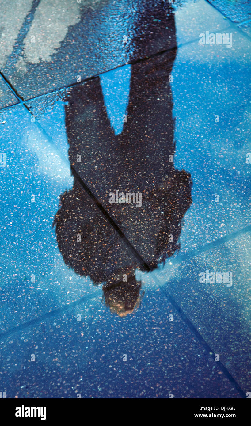 Man Reflected in Puddle Stock Photo - Alamy