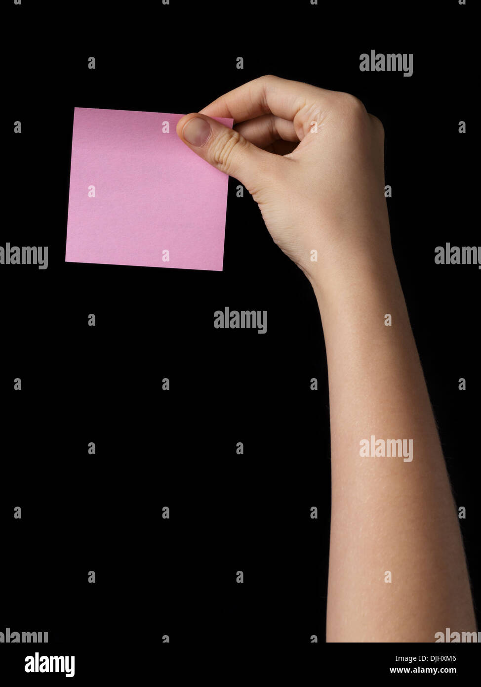 female teen hand holding sticky note, isolated on black Stock Photo - Alamy
