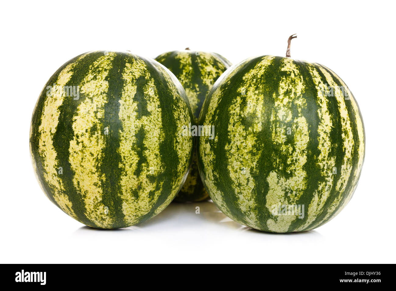 Three watermelons on the table isolated on white Stock Photo - Alamy