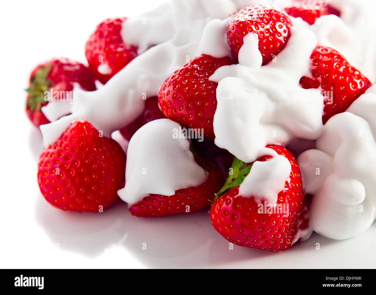 strawberry with cream isolated on white reflexive background Stock ...