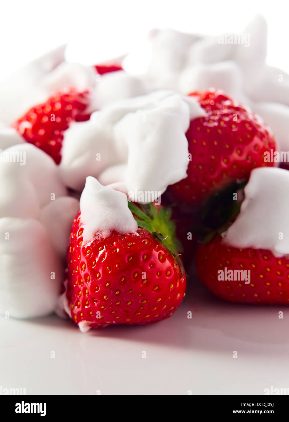 strawberry with cream isolated on white reflexive background Stock ...