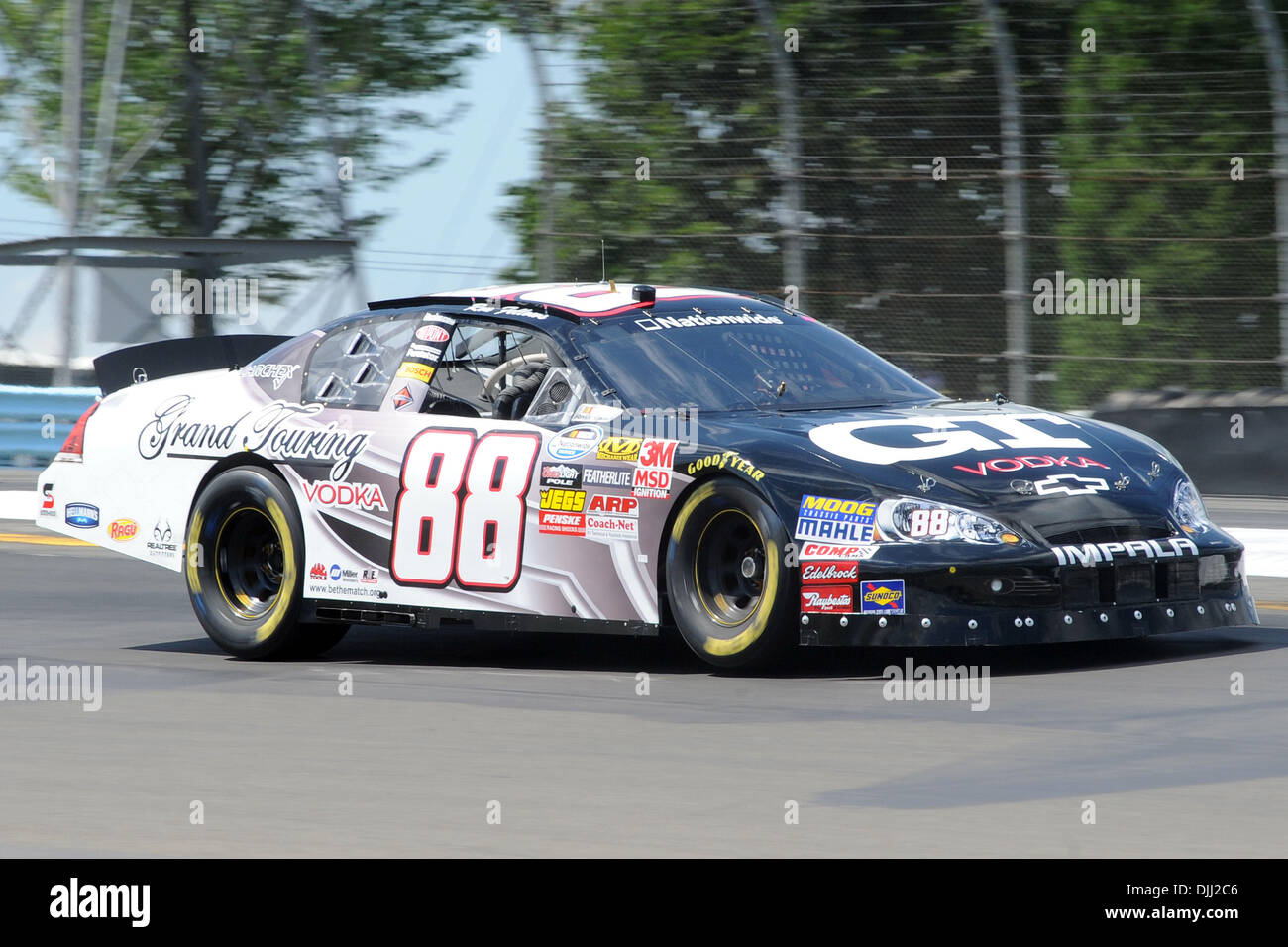 RON FELLOWS wheels the Grand Touring Vodka Chevrolet through turn one ...