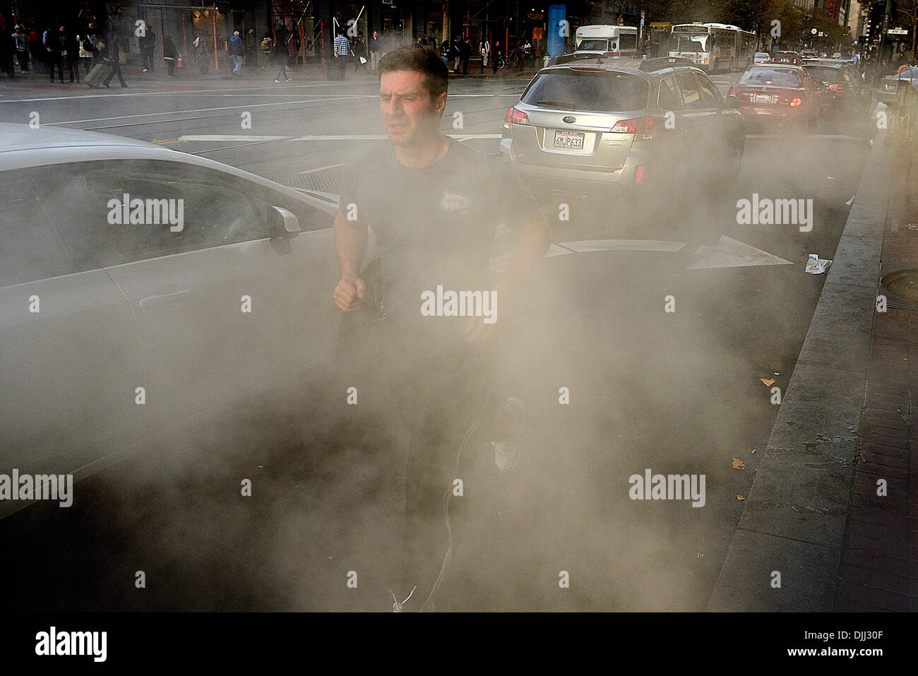 man runs through steam san francisco Stock Photo - Alamy