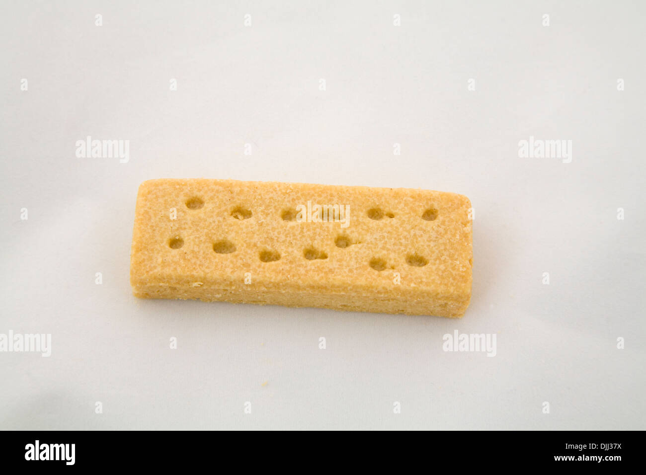 Close up single shortbread cookie finger on white background Stock ...