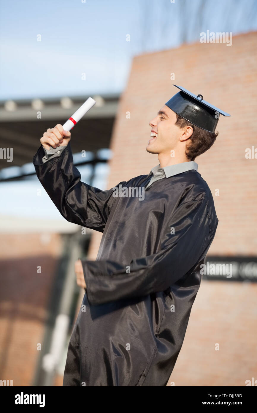 Man Holding Diploma On Graduation Day At Campus Stock Photo - Alamy