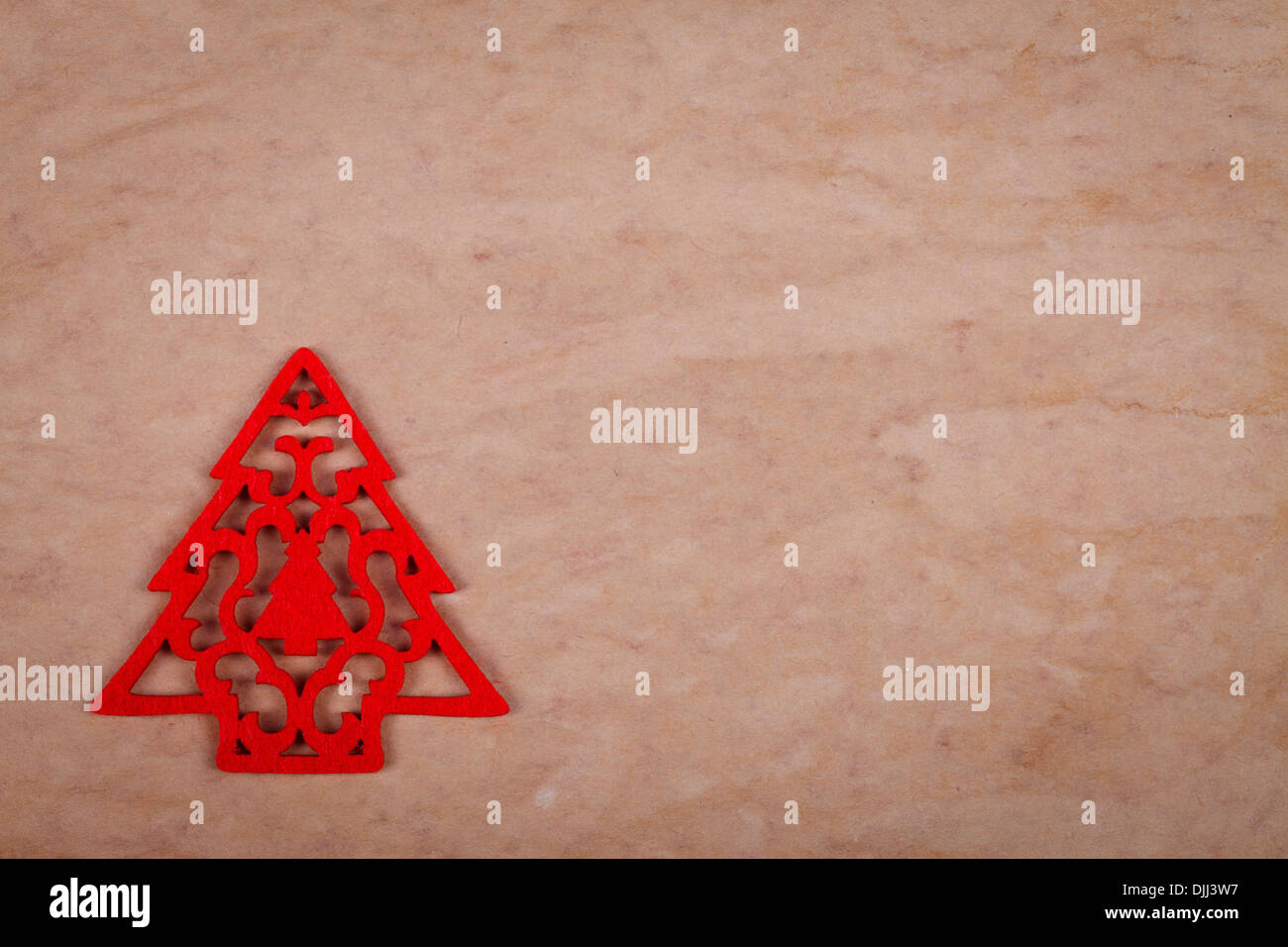Red fleece Christmas tree in vintage paper background Stock Photo - Alamy